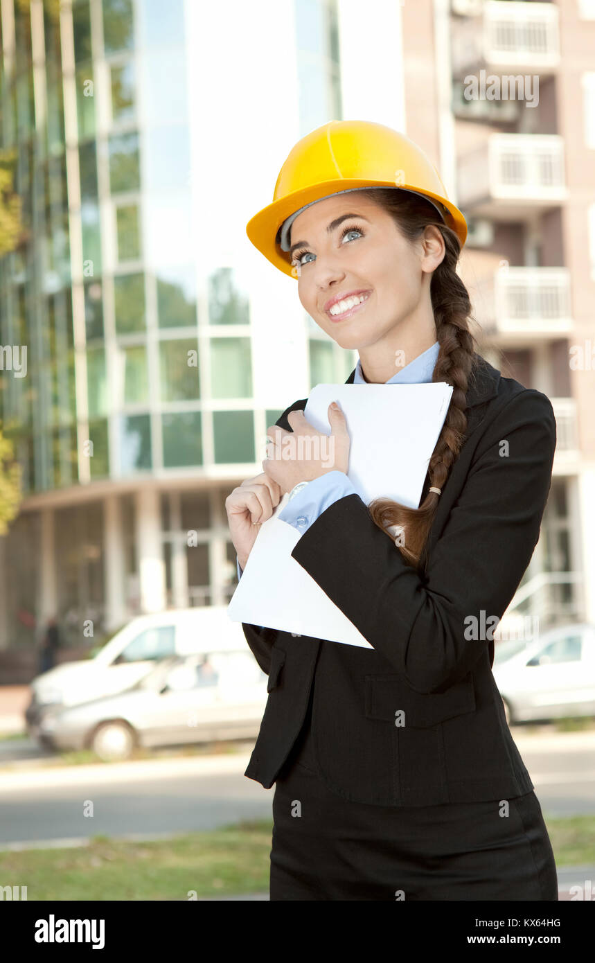 smiling female engineer with her project in background Stock Photo - Alamy
