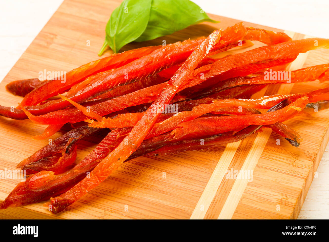 Salmon dry sticks snack Stock Photo - Alamy
