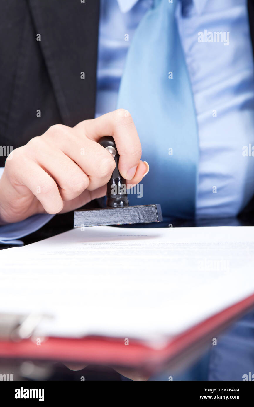 female hand stamping document, close up Stock Photo - Alamy