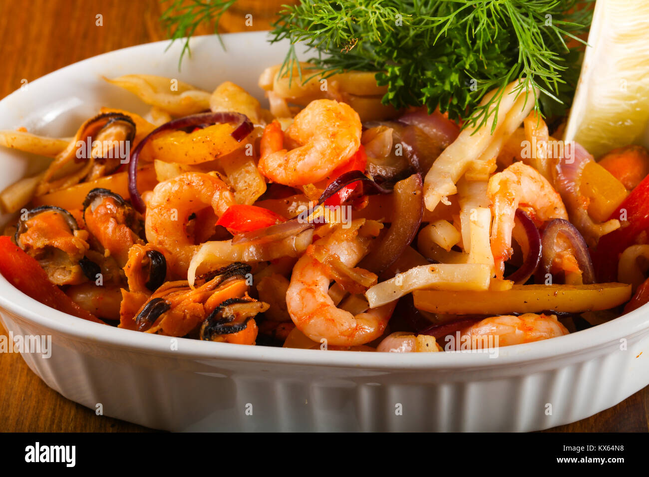 Seafood cocktail with squid, mussels and shrimps Stock Photo - Alamy