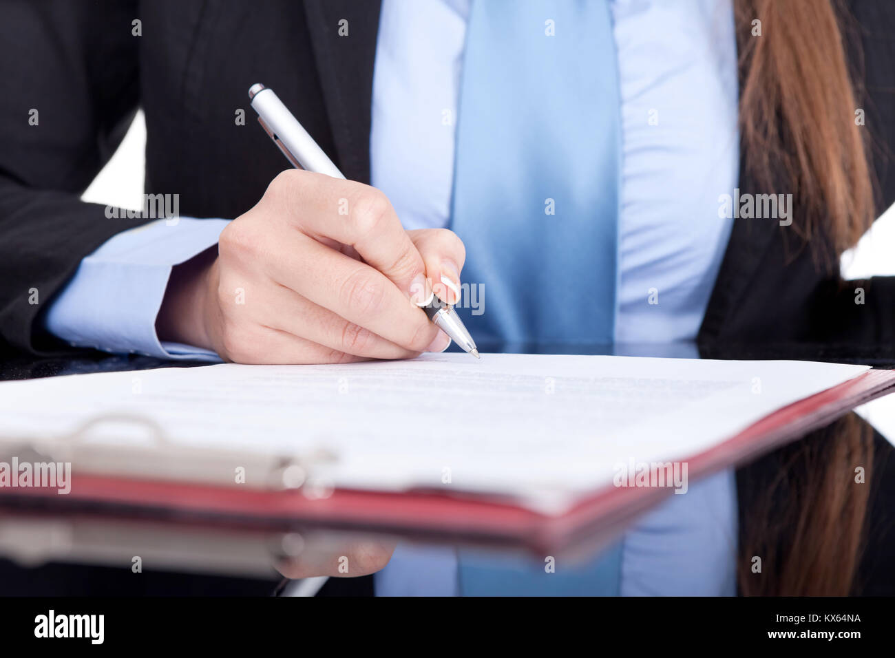 female hand with pen signing document, close up Stock Photo - Alamy
