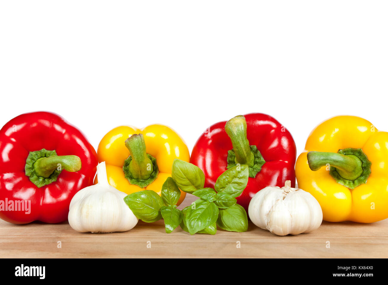 four bell peppers on isolated on white background Stock Photo - Alamy