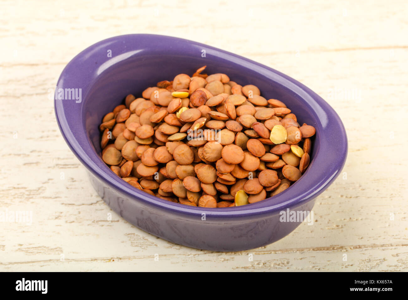 Raw lentils in the bowl ready for cooking Stock Photo - Alamy