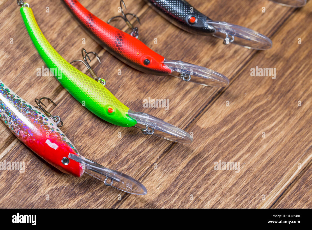 Spinning lures and spinning on wooden background,Close-Up Stock Photo ...