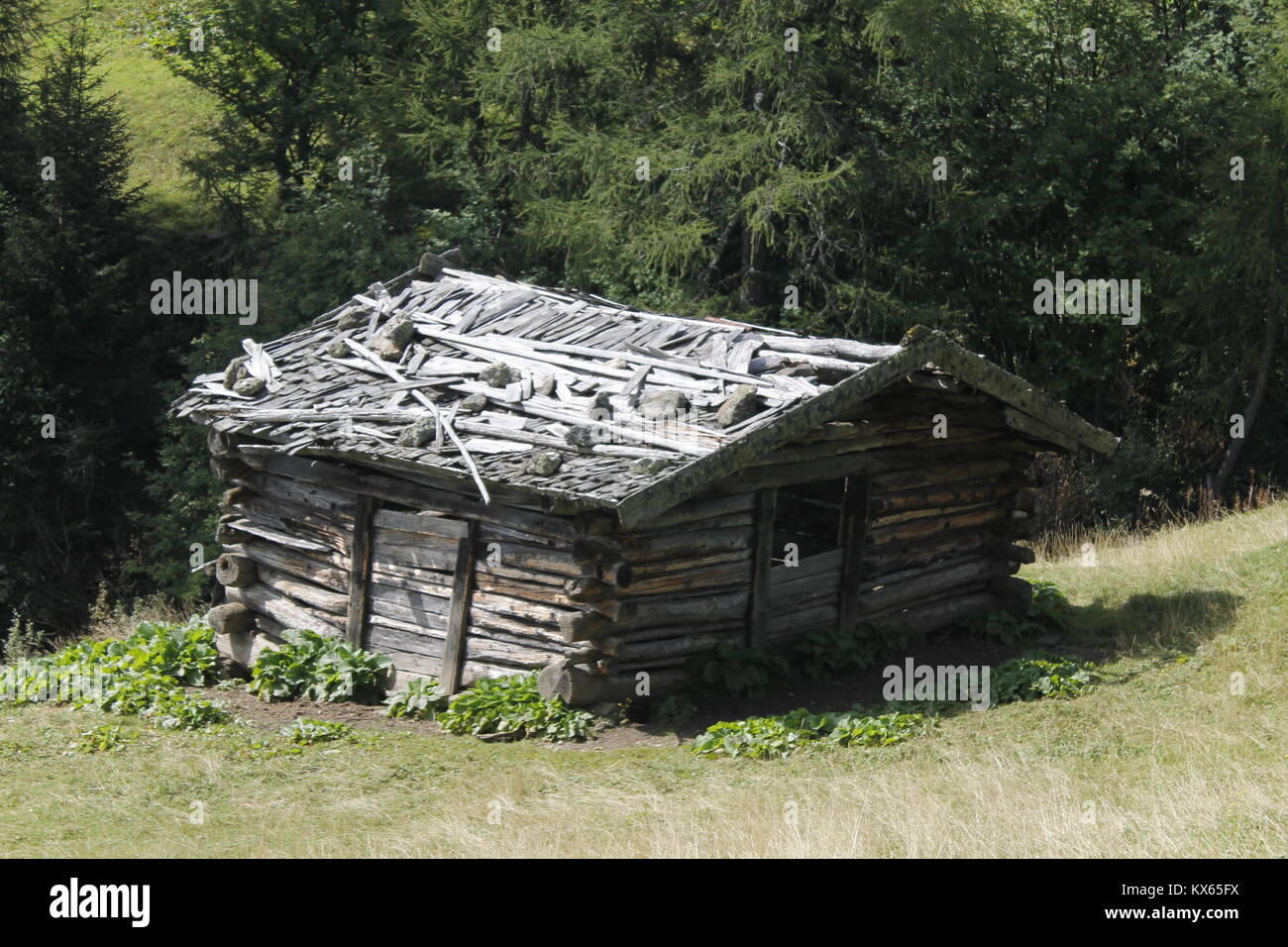 typical mountain huts on the Alps in Italy Stock Photo - Alamy