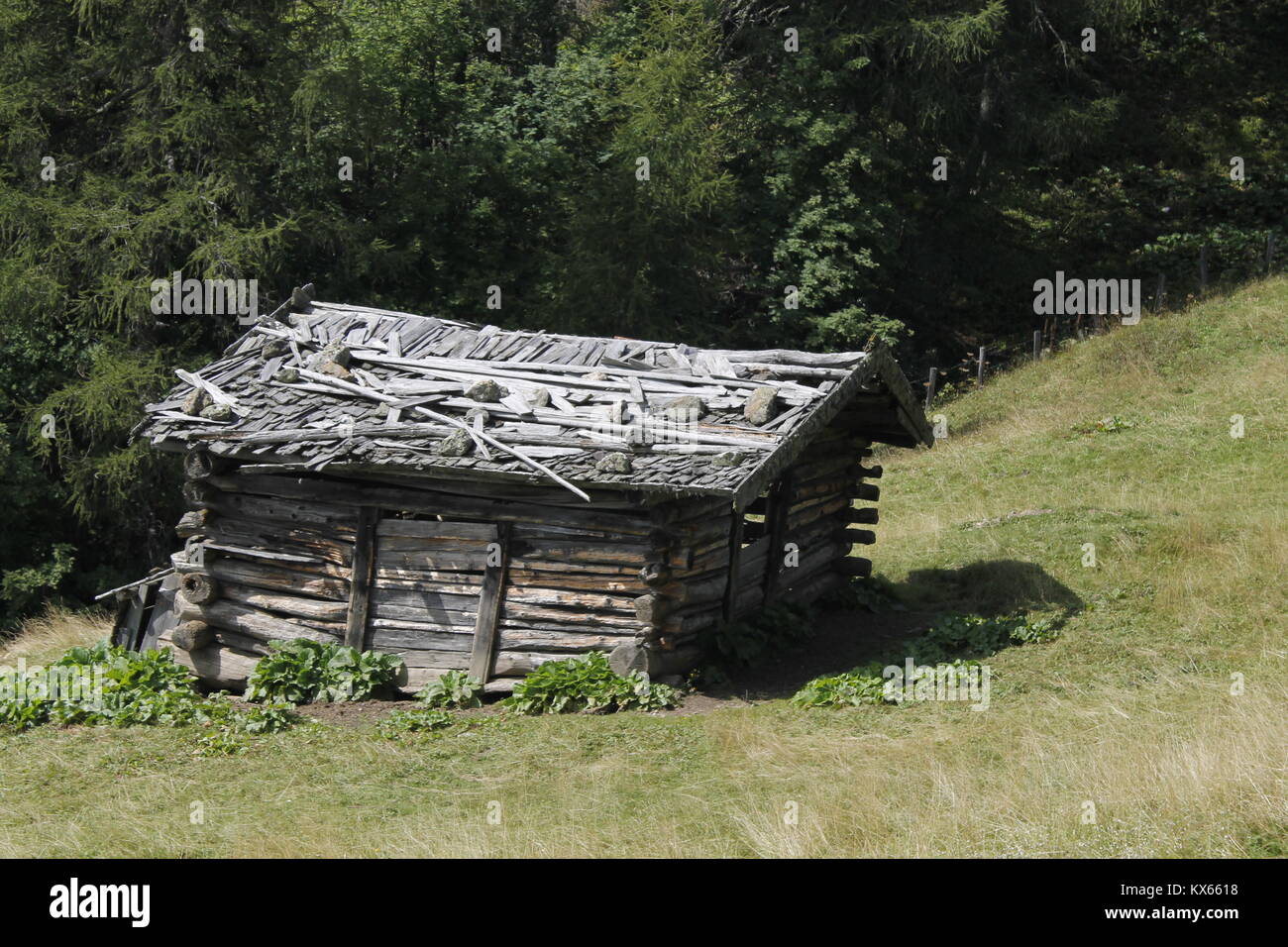 typical mountain huts on the Alps in Italy Stock Photo - Alamy