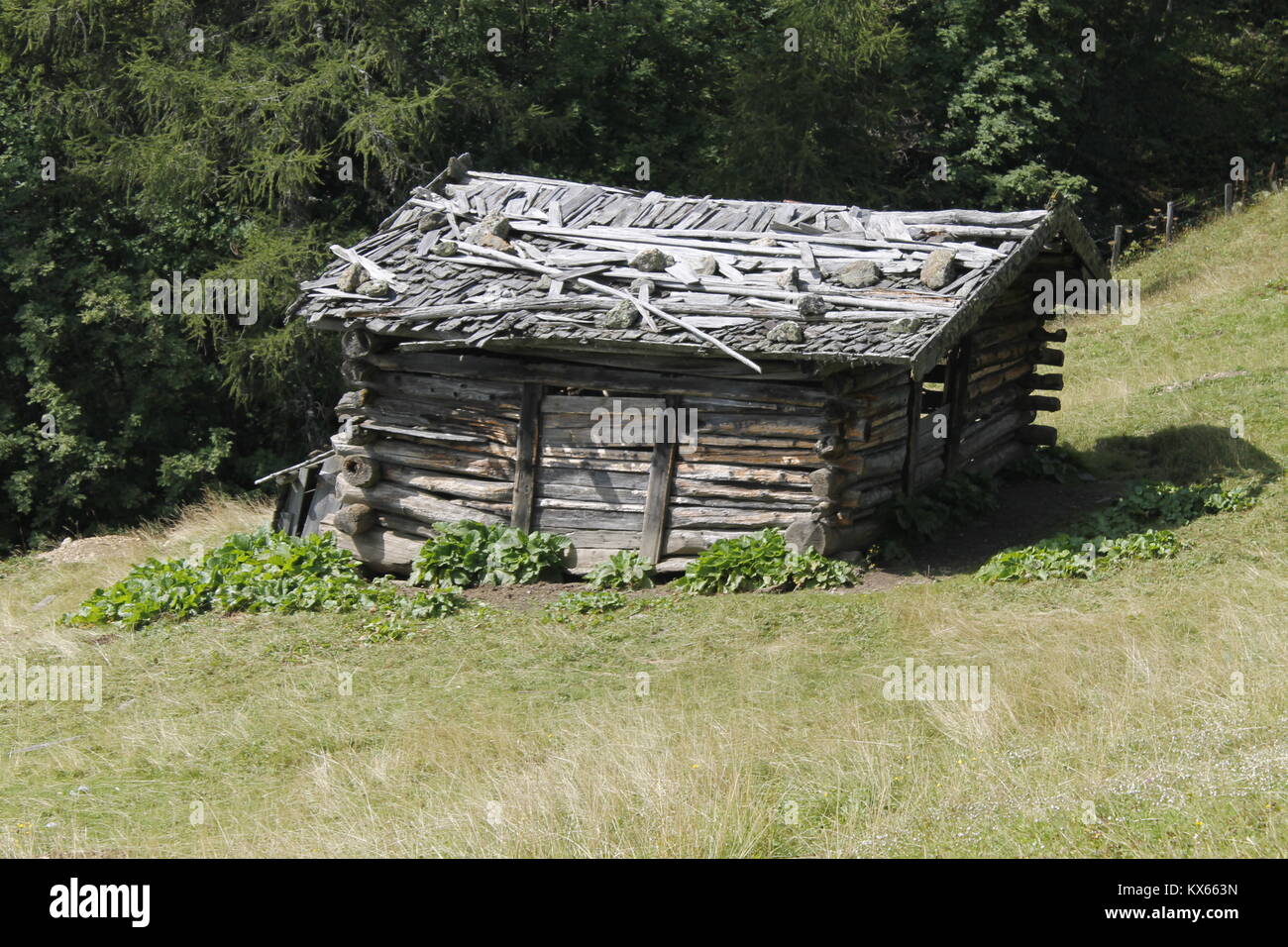 typical mountain huts on the Alps in Italy Stock Photo - Alamy