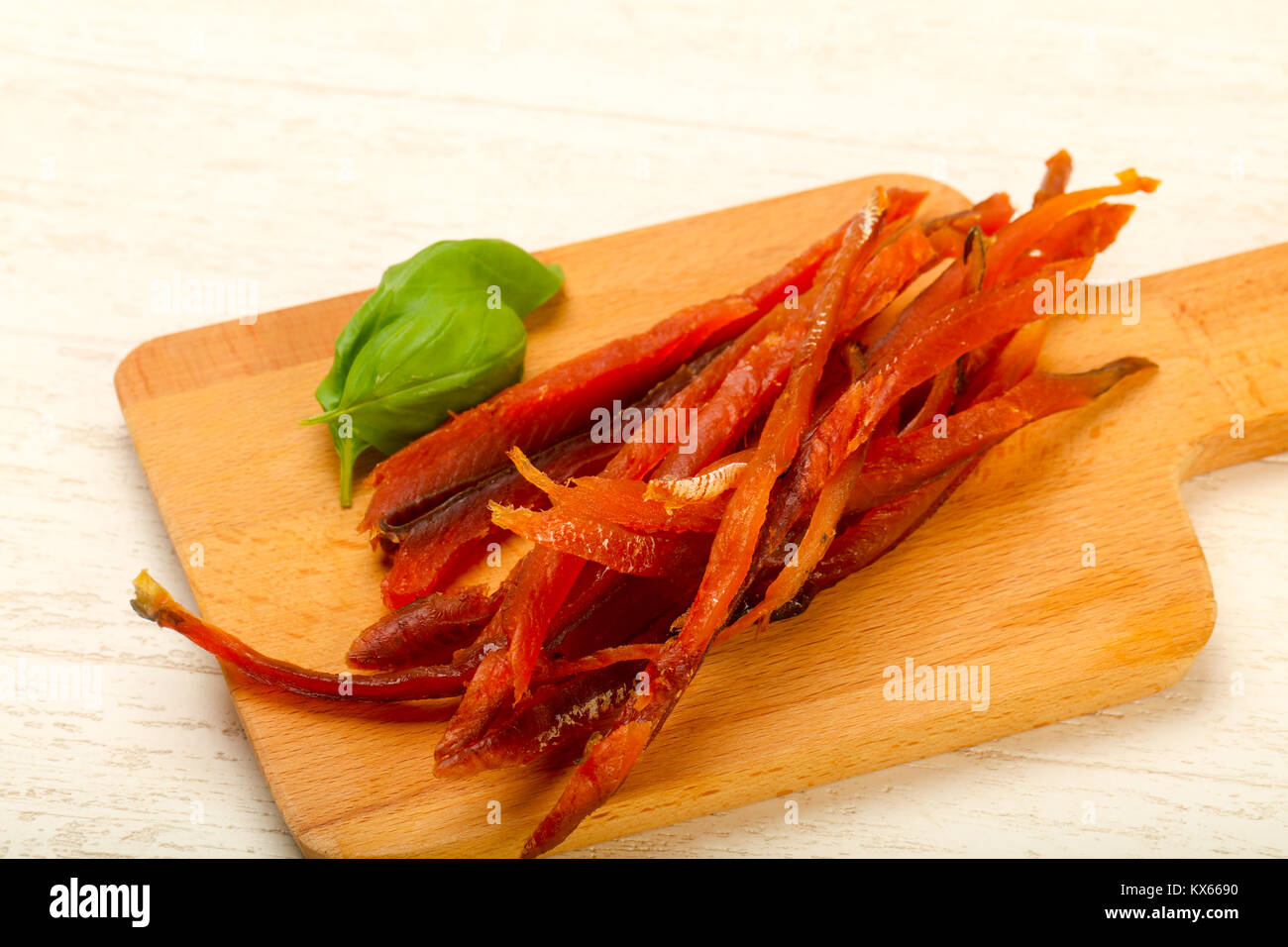 Salmon dry sticks snack Stock Photo - Alamy