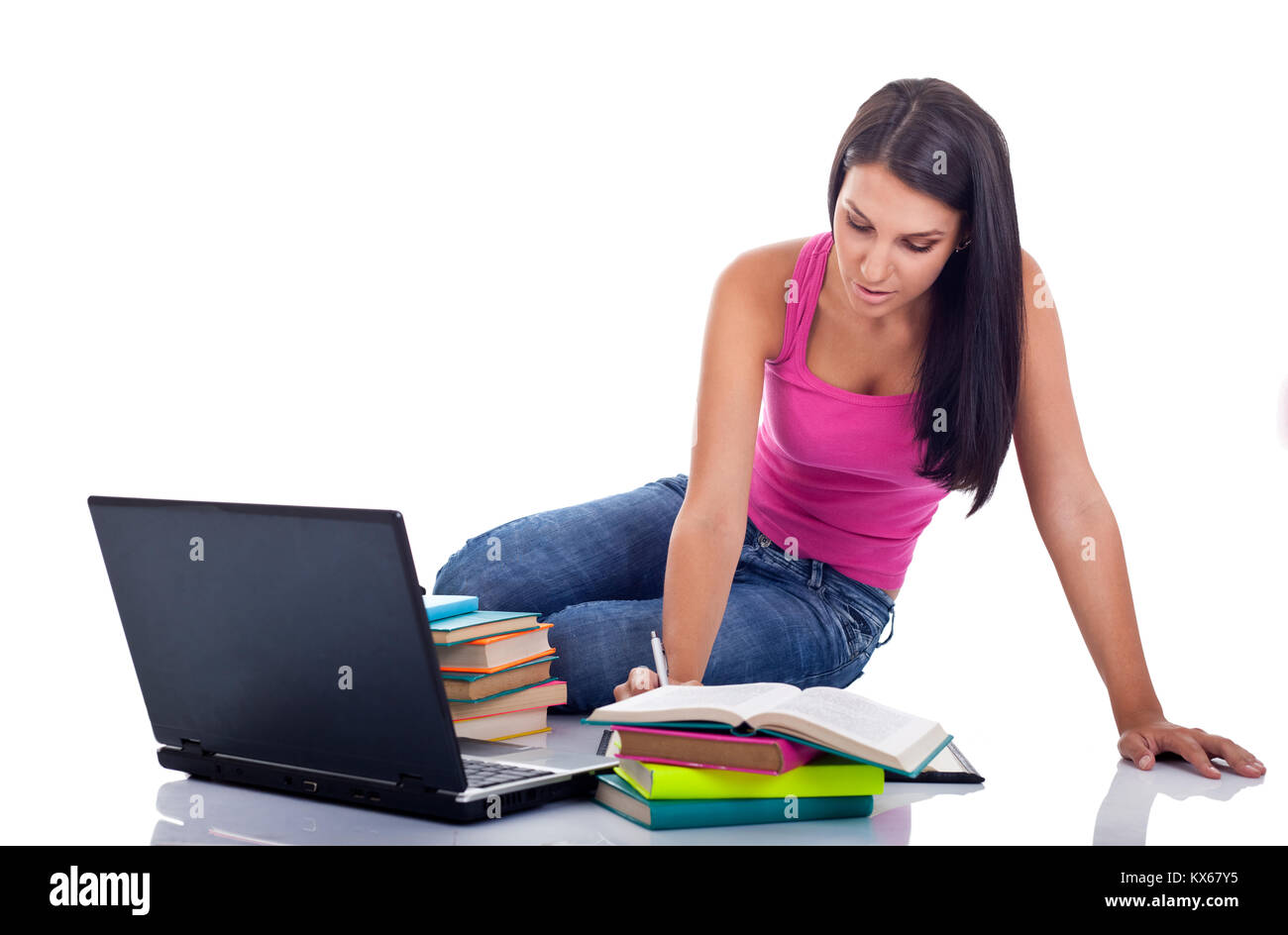 pretty student girl learning on floor, isolated on white background ...
