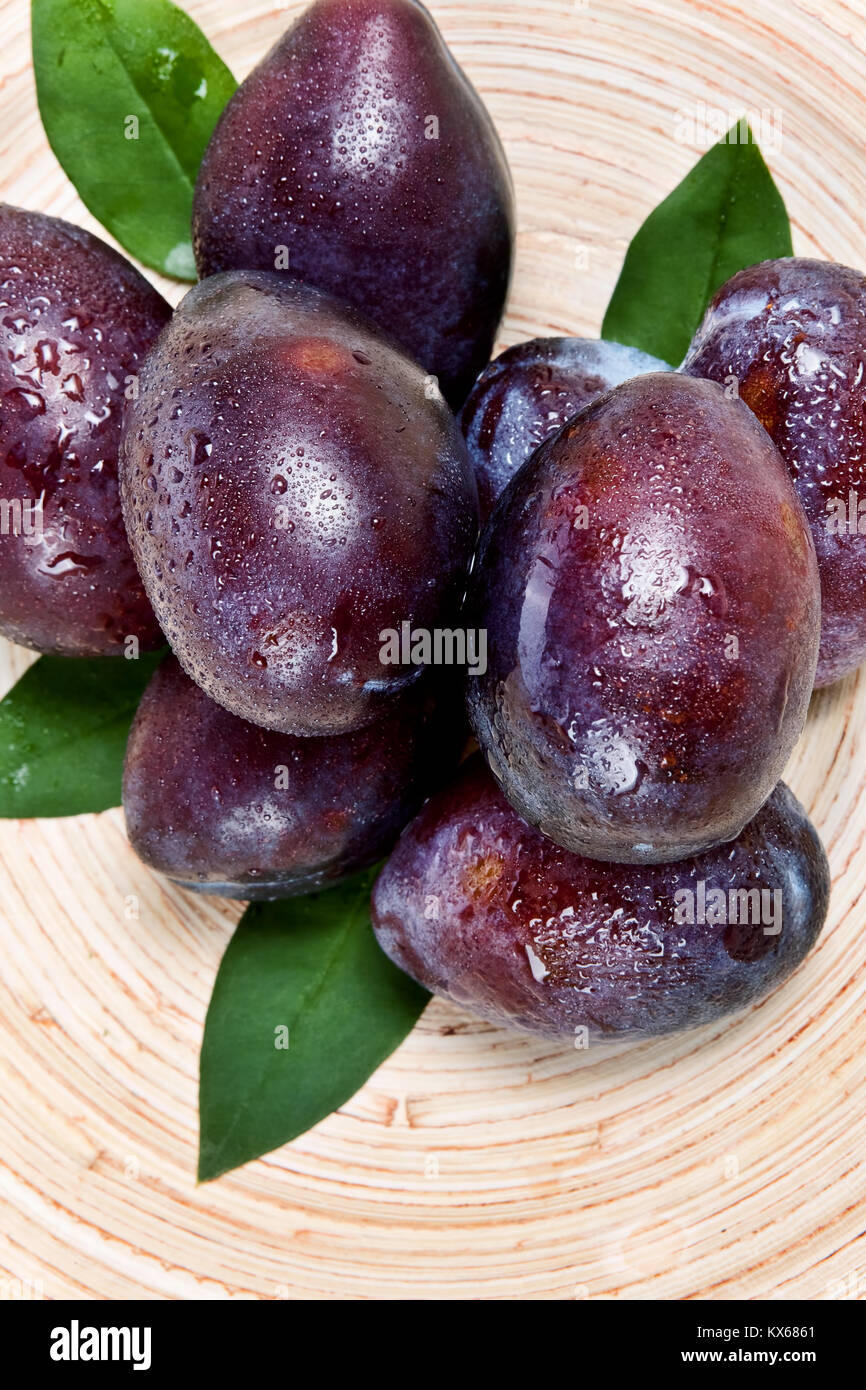 Wet plums on plate hi-res stock photography and images - Alamy