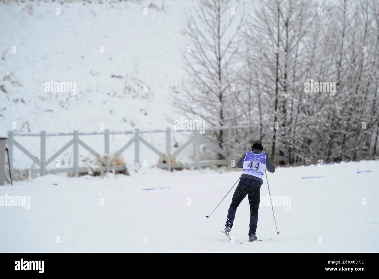 Mr. Josh Shirley representing Salt Lake City, Utah, skis up a hill ...