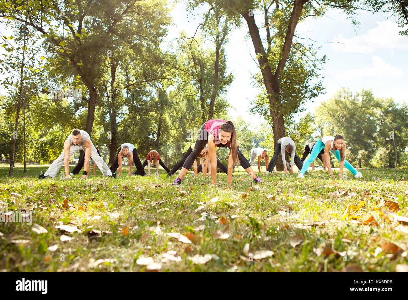 group of young people stretching outdoor Stock Photo - Alamy
