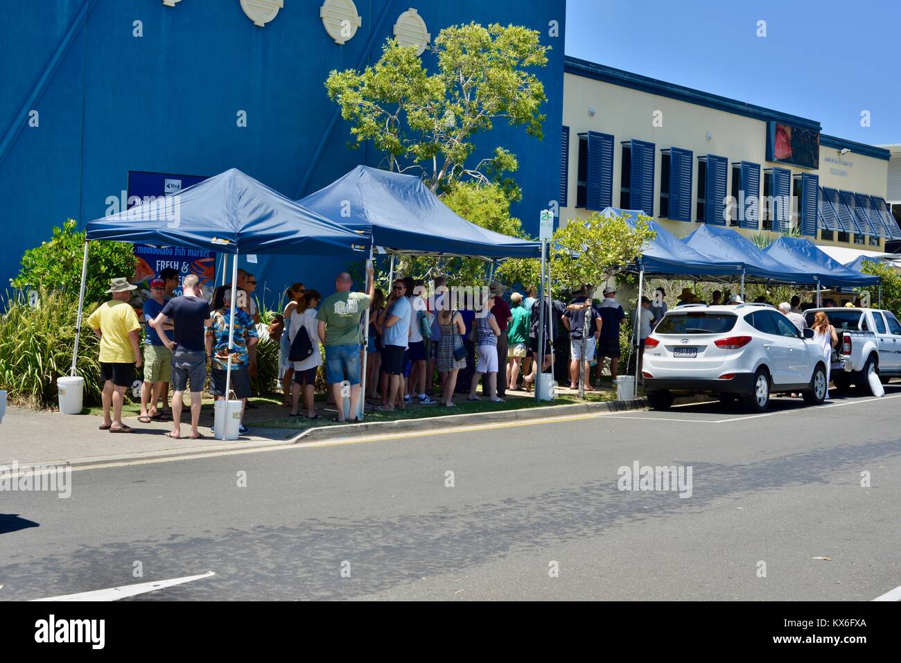 Lines of customers waiting to buy fresh seafood the day before ...