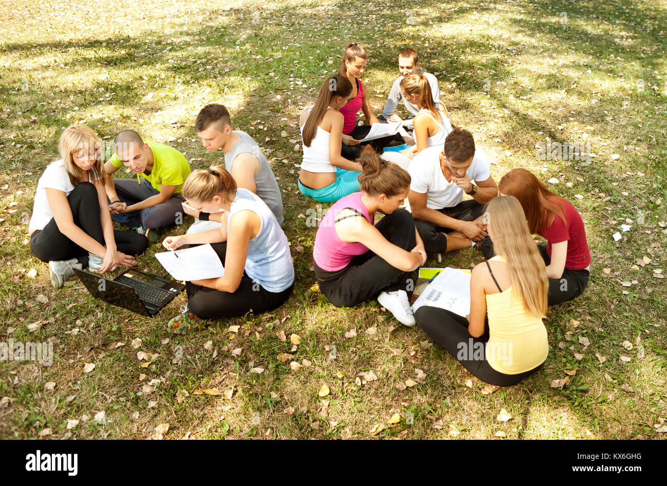 teamwork, students learning in park like a three teams Stock Photo - Alamy