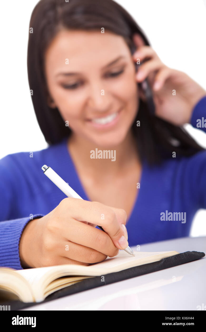 smiling girl on phone making notes, isolated on white background Stock ...