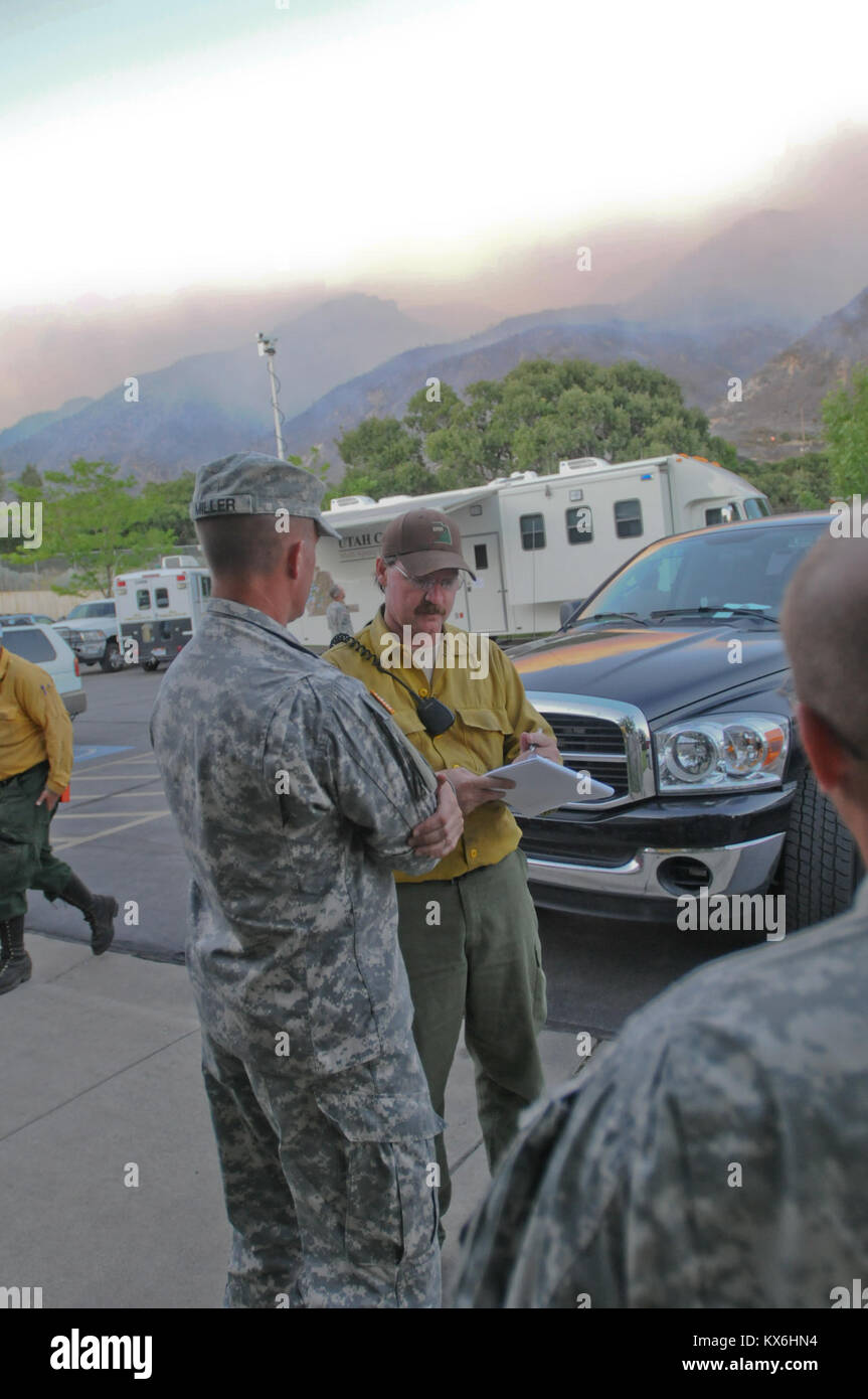 Firefighters from various state and local agencies and officers from ...
