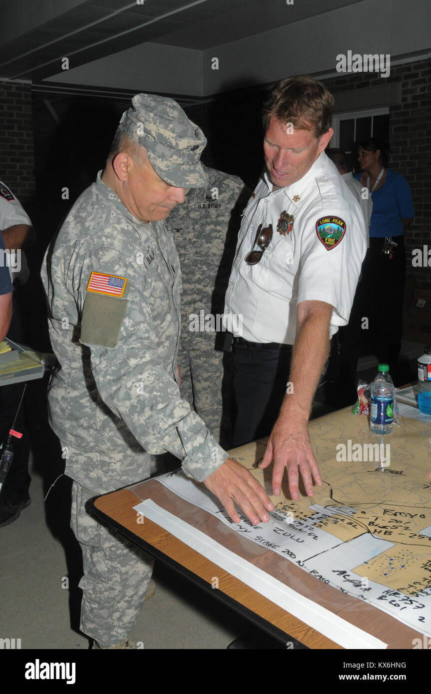 Firefighters from various state and local agencies and officers from ...