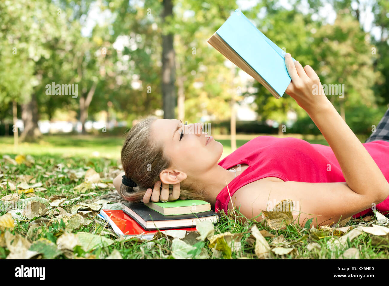 women in park concentrate on reading book Stock Photo - Alamy