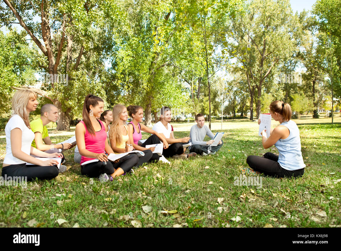 teacher with students having outside class Stock Photo - Alamy