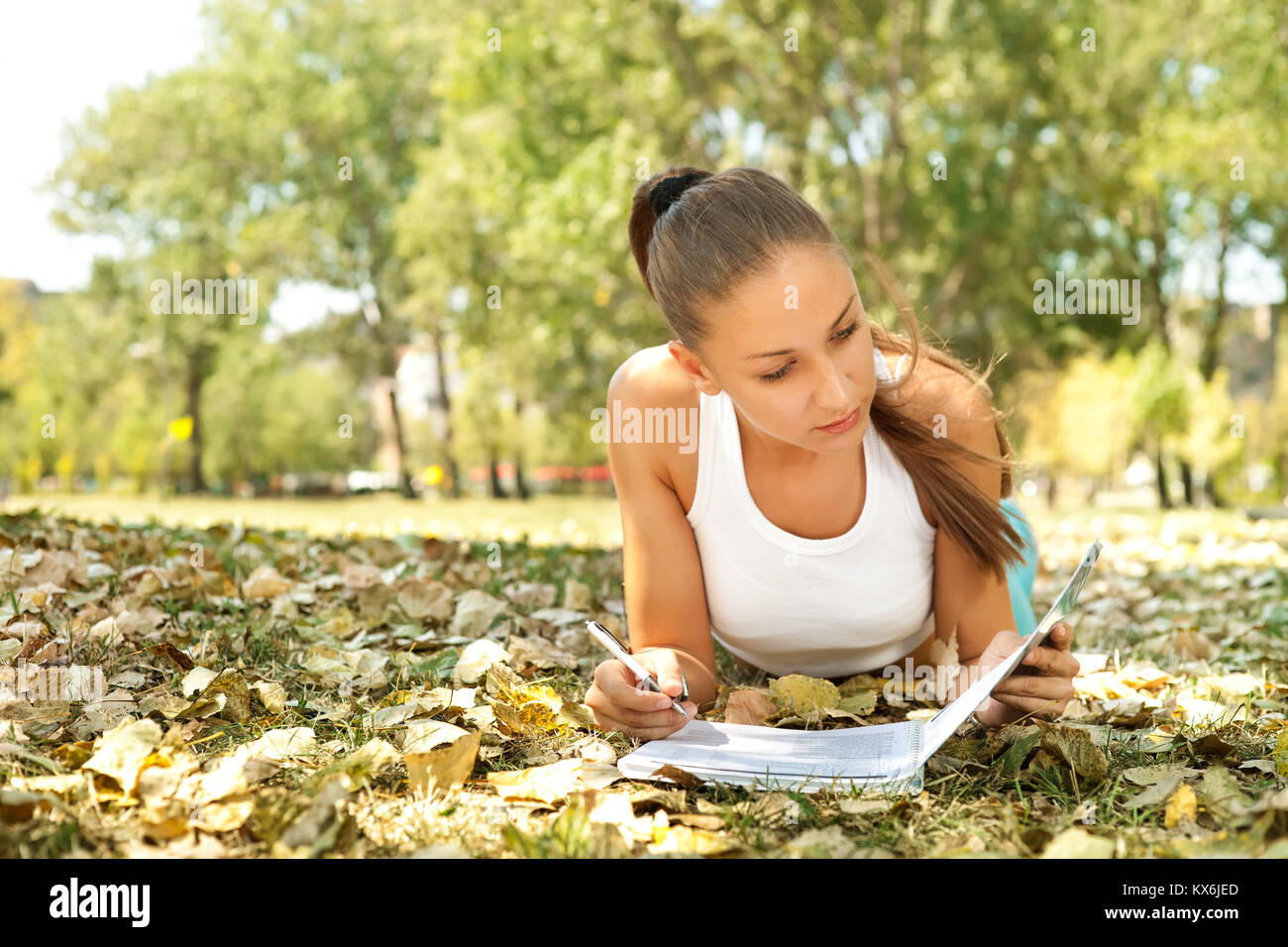 concentrate student girl learning in park Stock Photo - Alamy