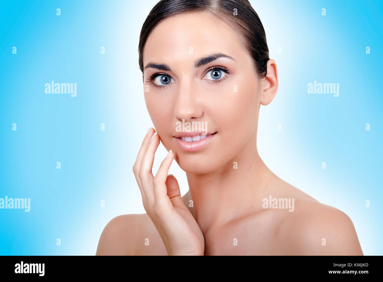 gentle spa woman with beautiful face on blue background Stock Photo - Alamy