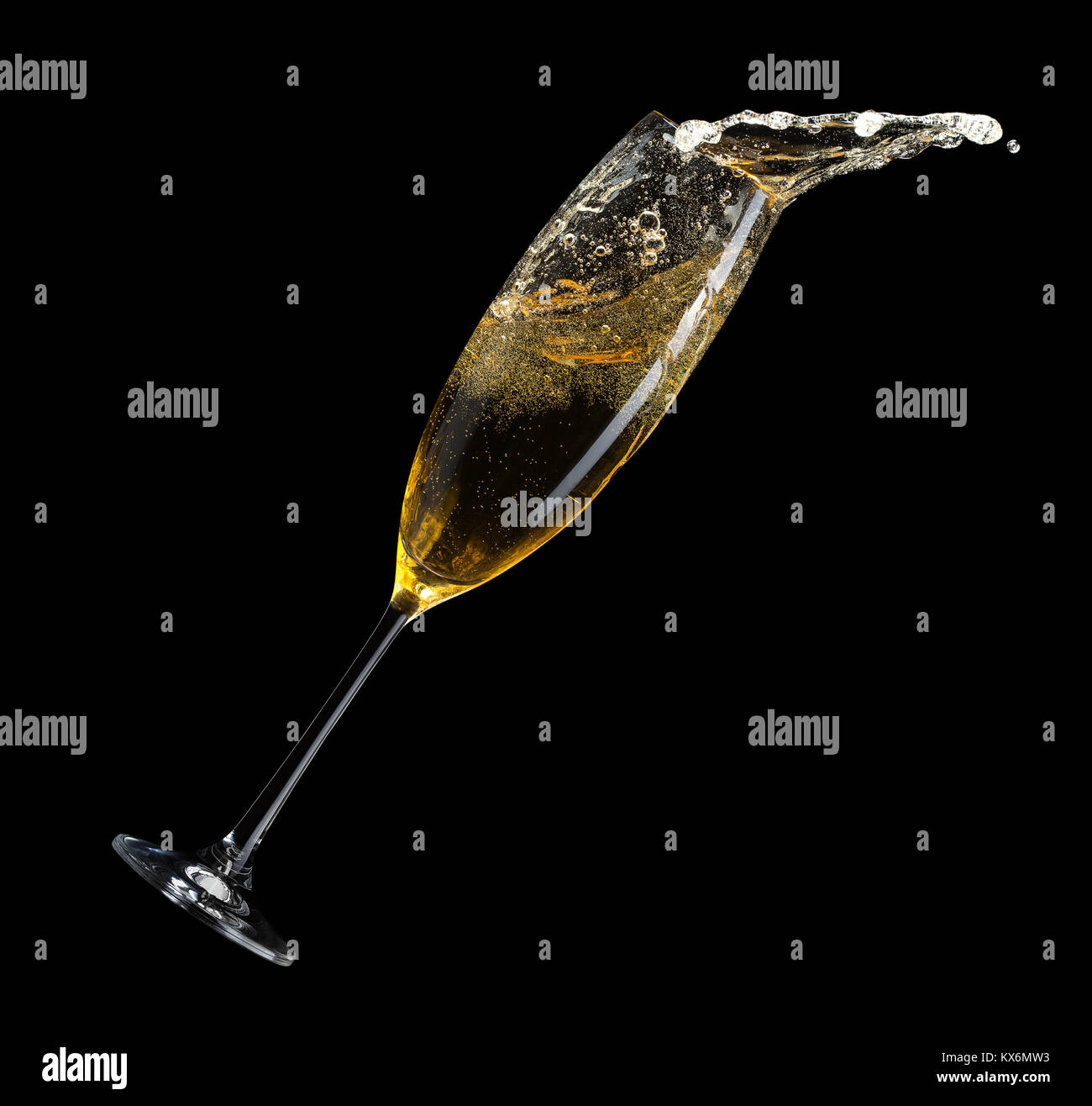champagne splash from glass on a black background Stock Photo - Alamy