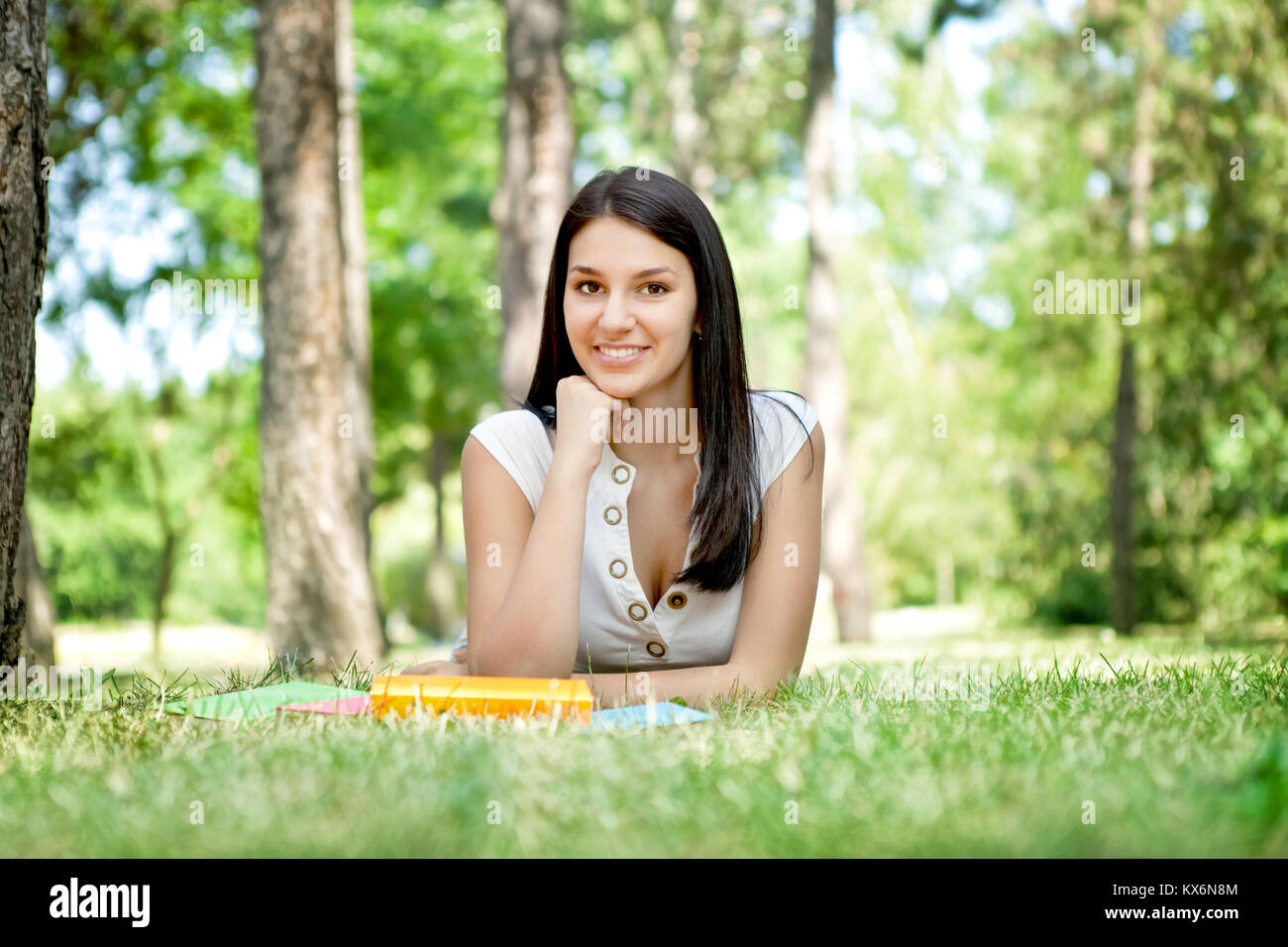 beautiful girl reading a book and relax in the park Stock Photo - Alamy