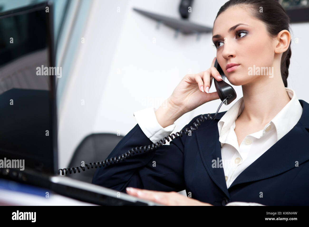 businesswoman taking telephone call in her office Stock Photo - Alamy