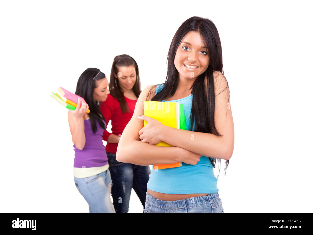 student girl hugging books with group university students on the ...