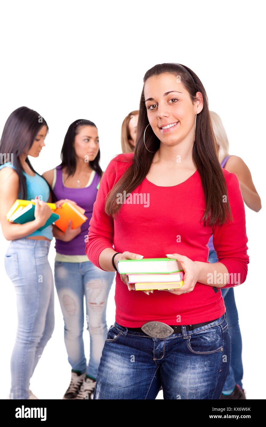 smiling student girl holding books with group university students on ...