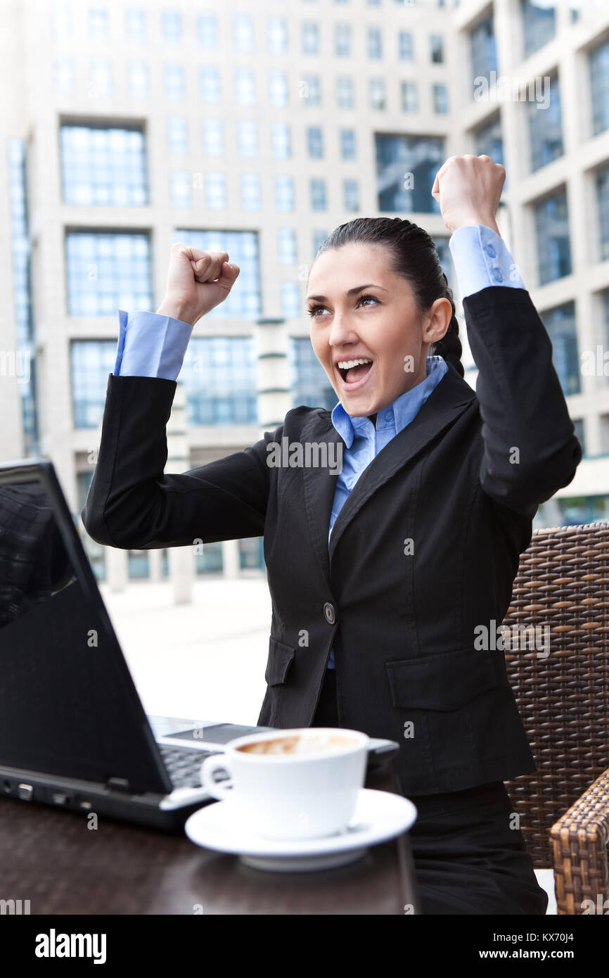 beautiful young businesswoman celebrating her winning Stock Photo - Alamy