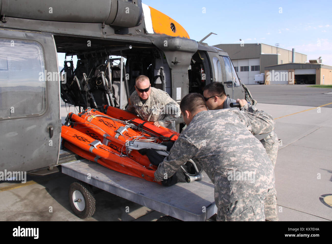 Soldiers of the Utah Army National Guard's 2-211th Aviation load Bambi ...