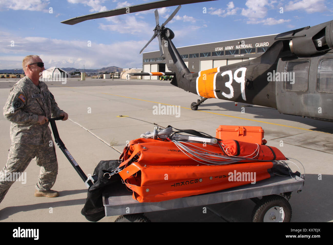 Soldiers of the Utah Army National Guard's 2-211th Aviation load Bambi ...