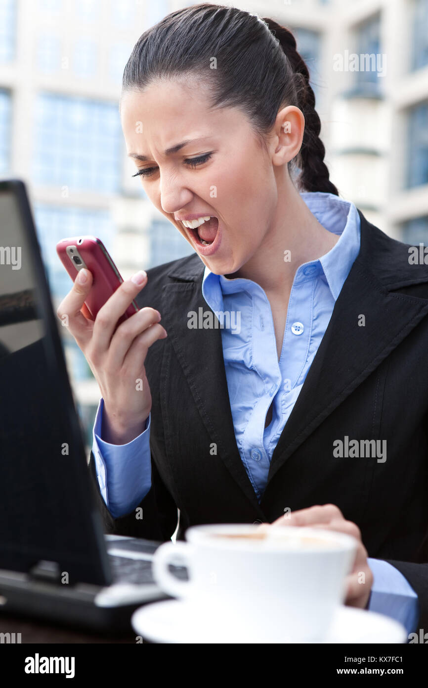 Businesswoman yell phone hi-res stock photography and images - Alamy