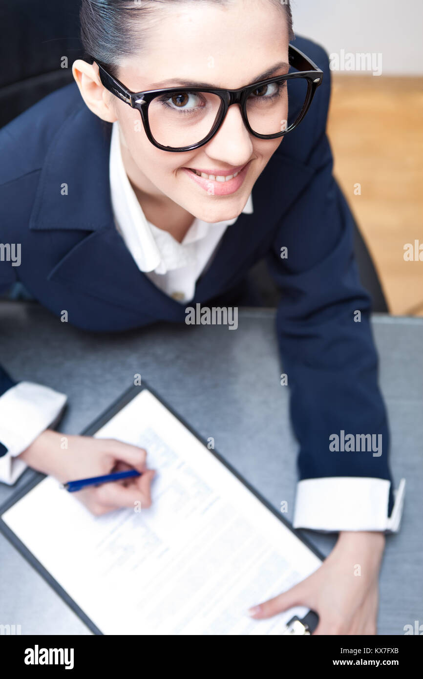 pretty secretary taking notes at office desk, top view Stock Photo - Alamy