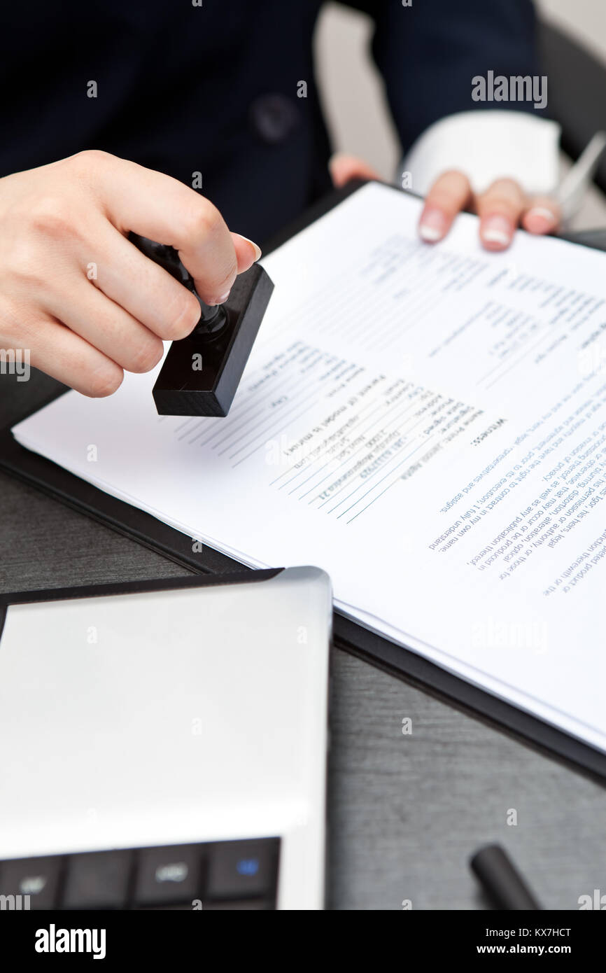 Office worker stamping documents hi-res stock photography and images ...