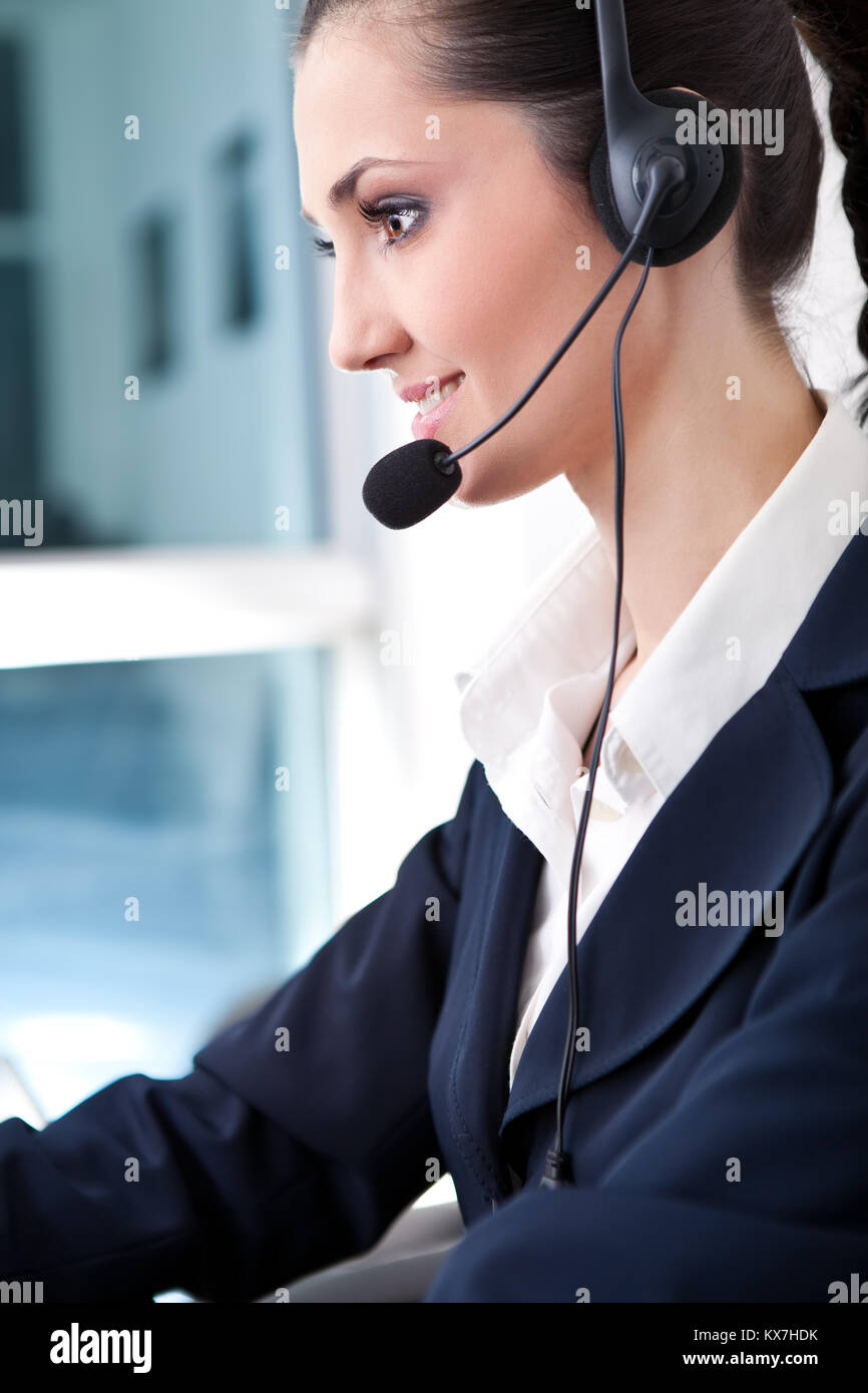 customer service operator woman with headset smiling, side view Stock ...