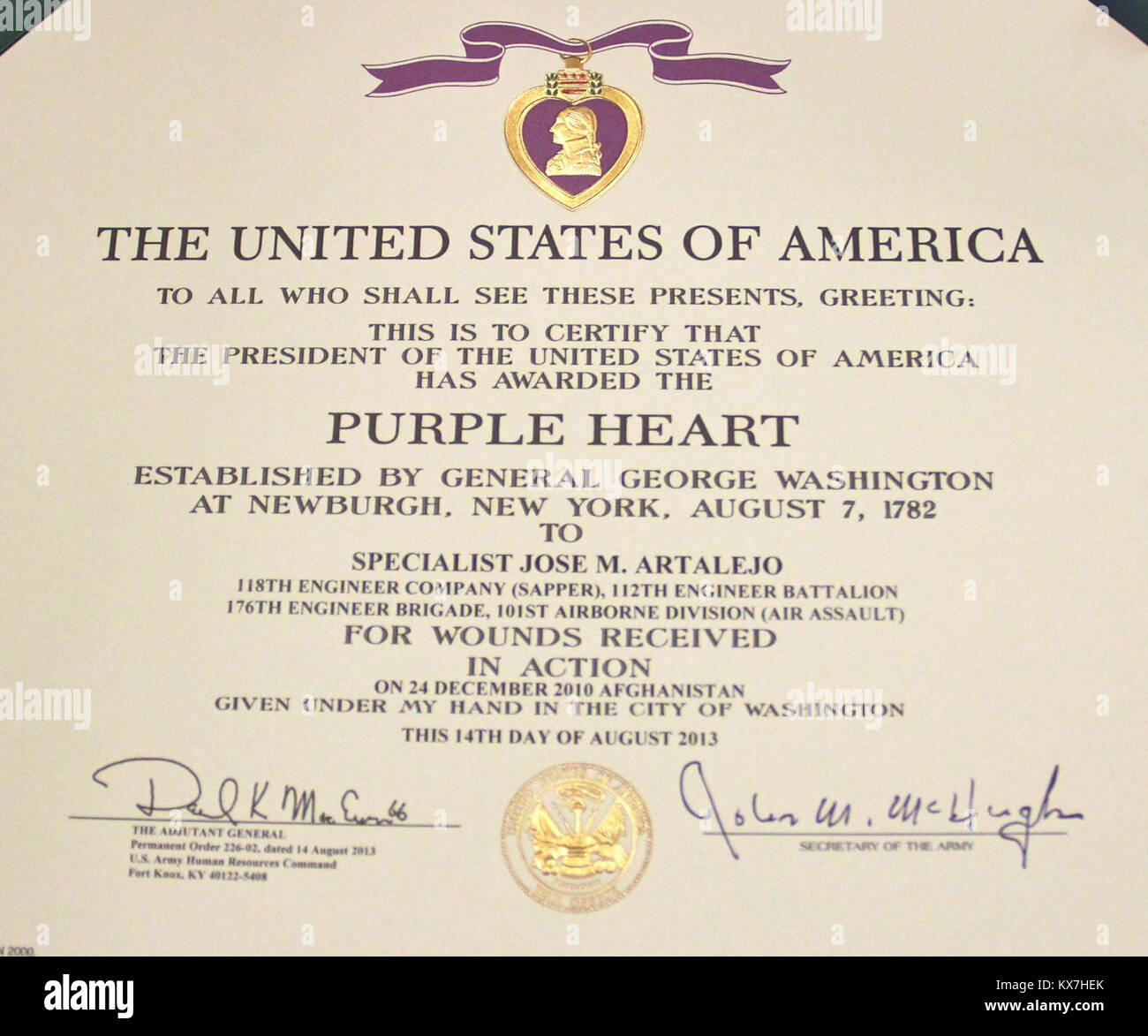 Spc. Joey Artalejo receives the Purple Heart Jan. 25, 2014, for wounds ...