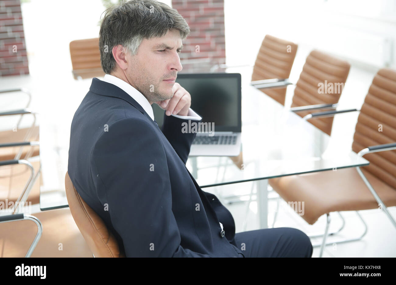 Boss sitting in the workplace before the meeting Stock Photo - Alamy