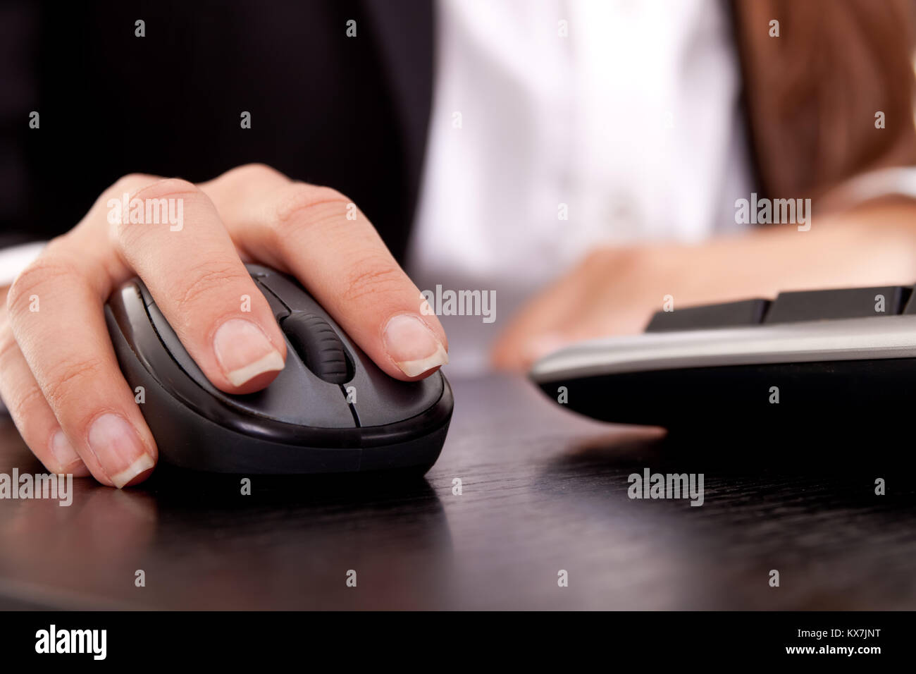 computer mouse with hand on desk Stock Photo - Alamy