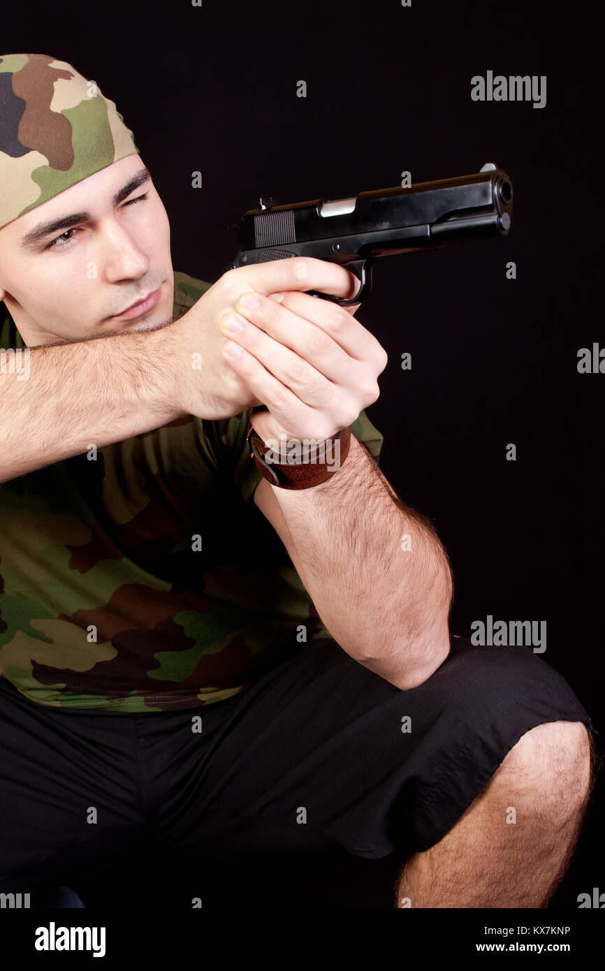 modern soldier with gun on black background Stock Photo - Alamy