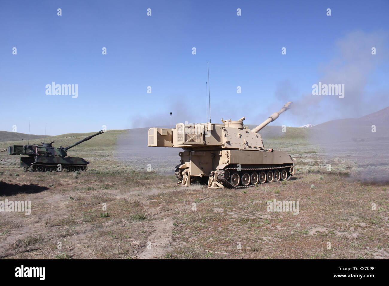 U.S. Army combat training in the desert. Self propelled Paladin ...