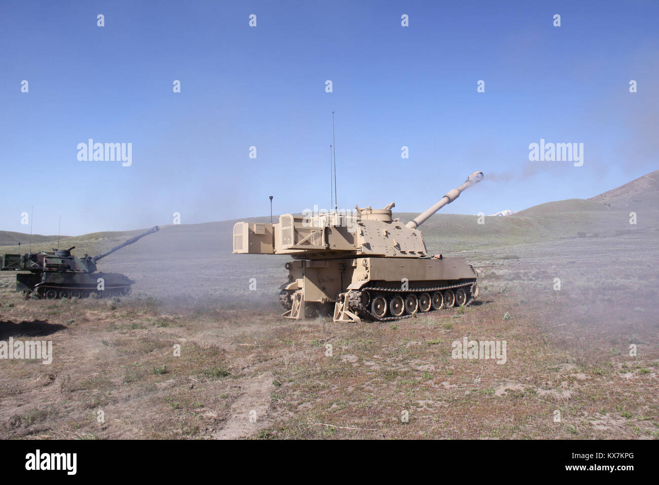 U.S. Army combat training in the desert. Self propelled Paladin ...