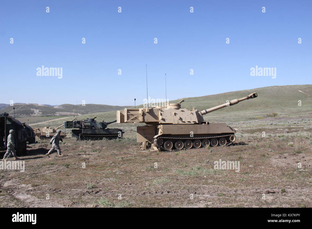 U.S. Army combat training in the desert. Self propelled Paladin ...