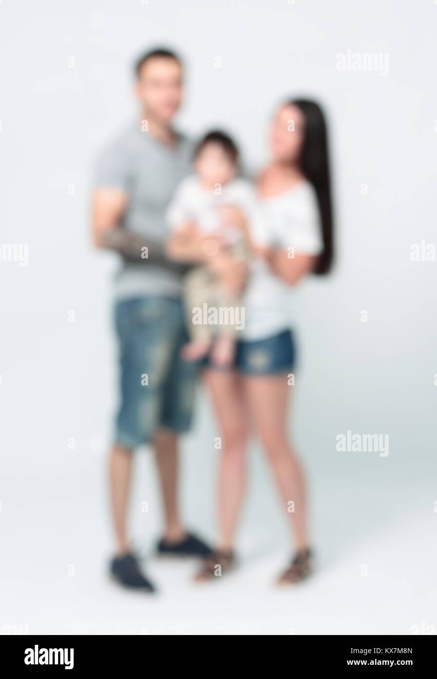 Blurred view of a family portrait with a child Stock Photo - Alamy