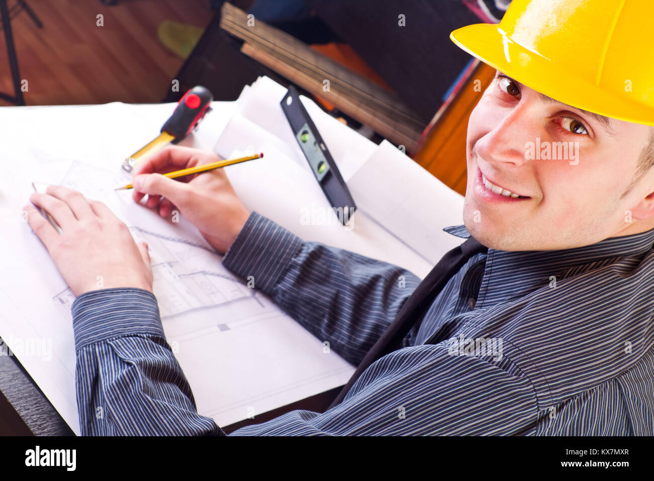 happy architect working on blueprint of house, close up Stock Photo - Alamy