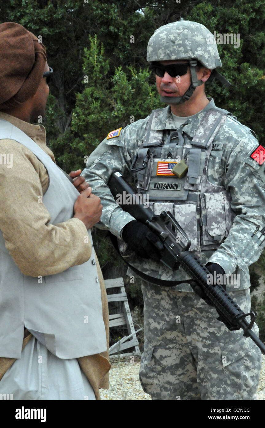 Sgt. Vladimir Kuvshinov, a human intelligence collector, speaks to a ...