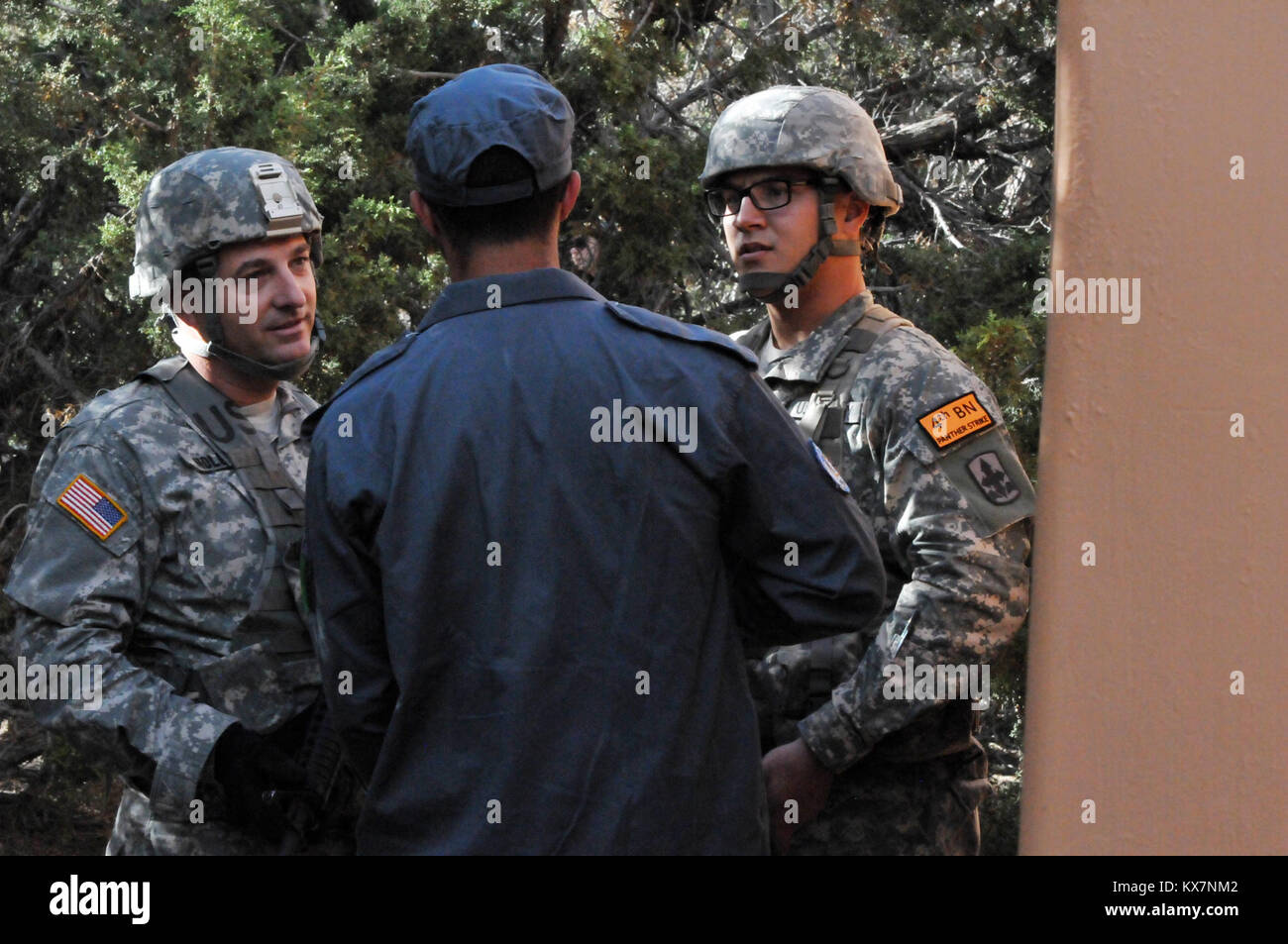 Human intelligence collectors try to get information from a role player ...