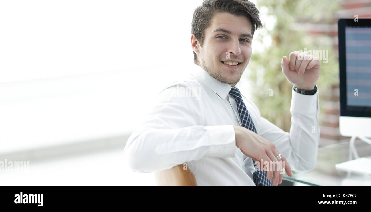 employee sitting in front of a computer screen Stock Photo - Alamy