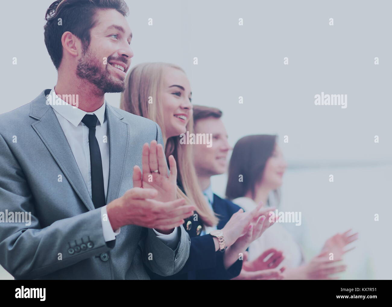 Satisfied proud business team clapping hands Stock Photo - Alamy